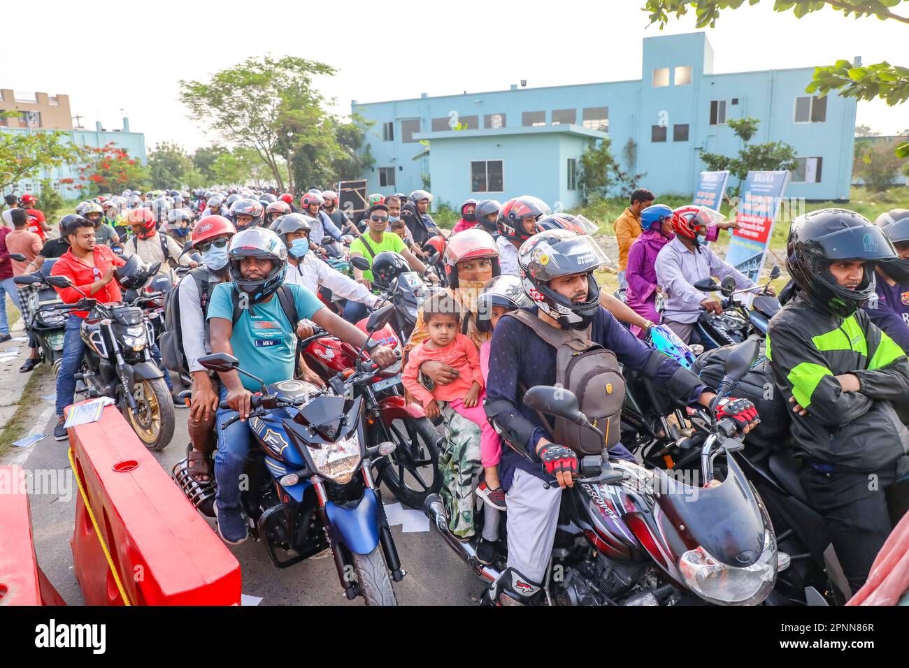 Dhaka, Bangladesh. 20th Apr, 2023. People on motorcycles queue to pay ...