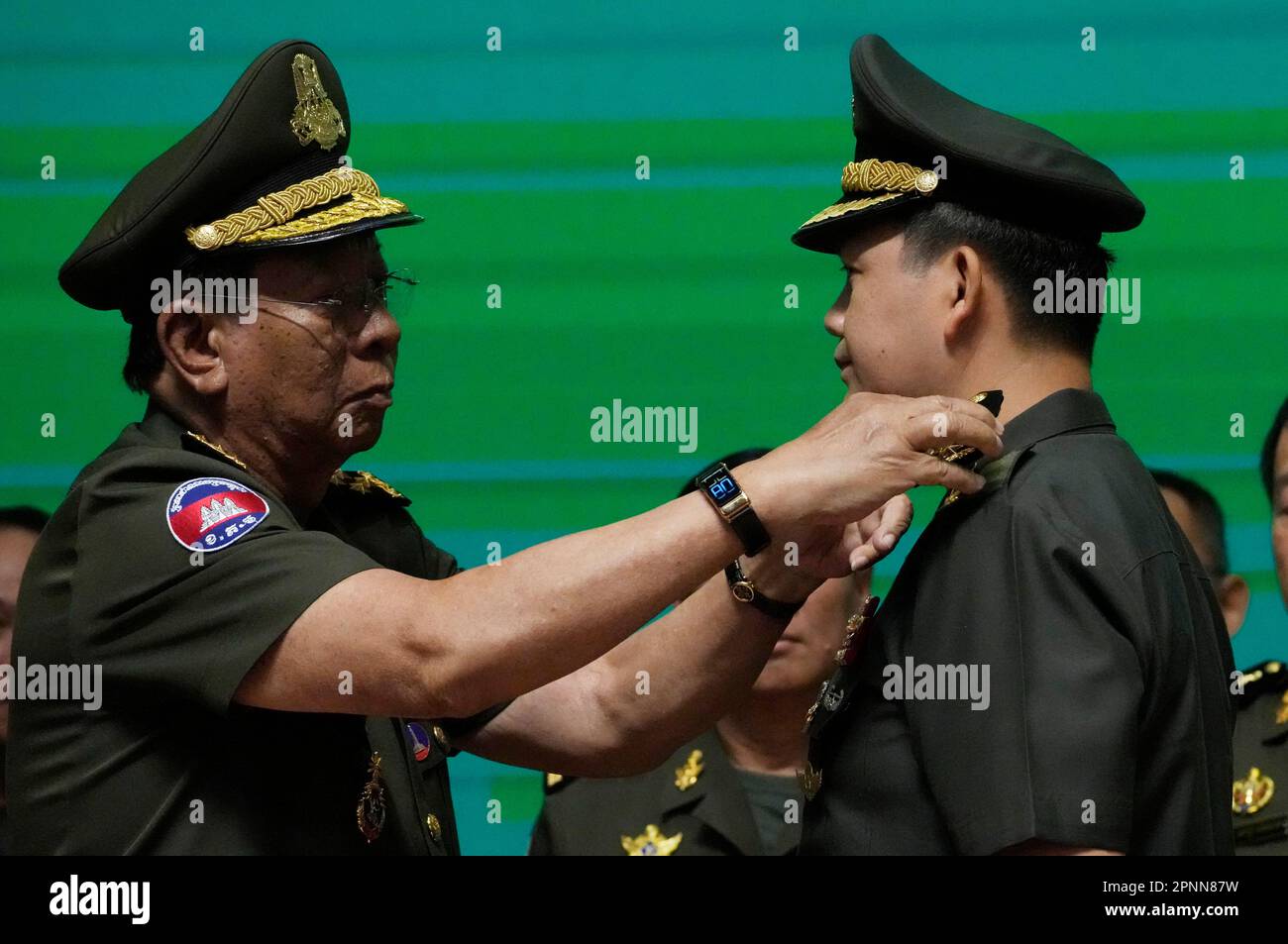 Cambodian army chief Hun Manet, right, a son of Cambodian Prime Minister Hun Sen, receives a ...