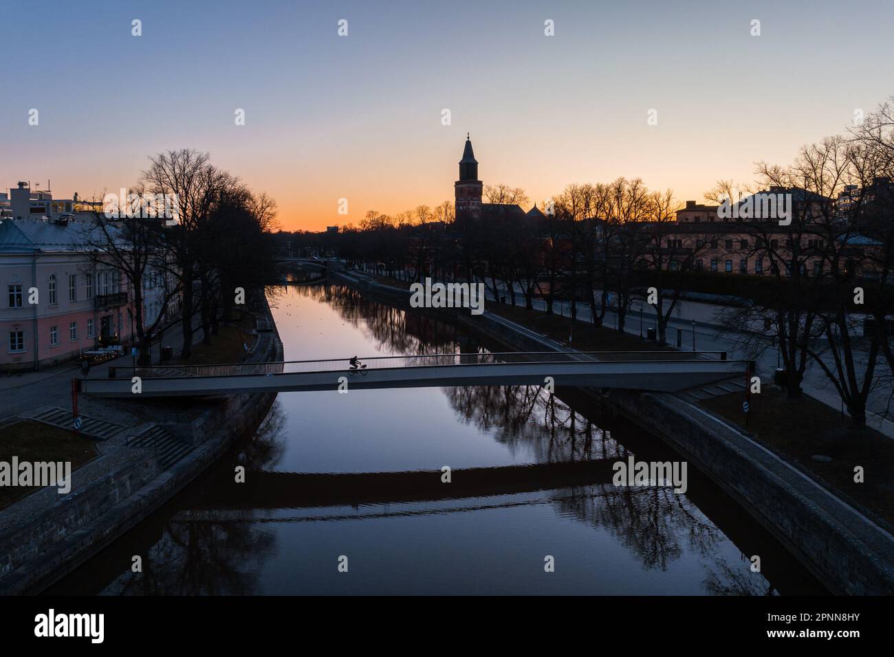 Aerial view of a person with bicycle on Kirjastosilta bridge in Turku ...