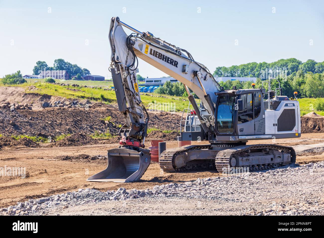 Excavator by a road construction site Stock Photo - Alamy