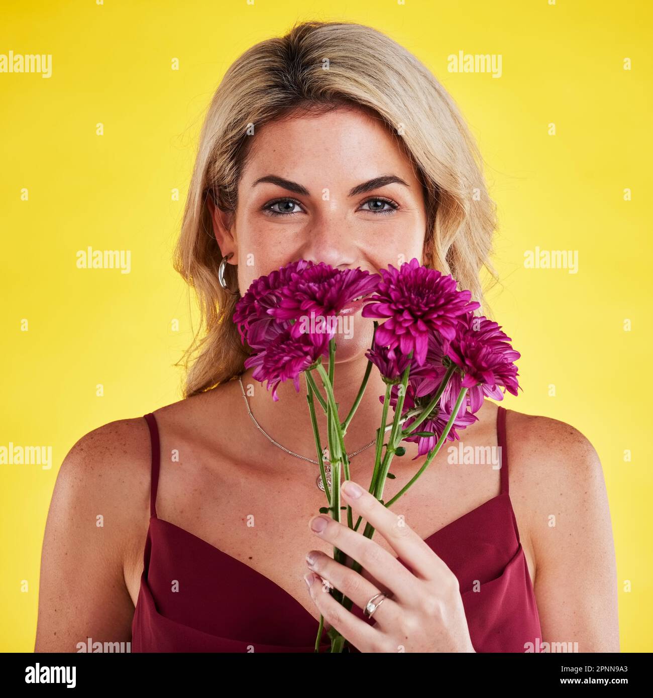 Portrait, smell and woman with flowers, beauty and confident girl ...