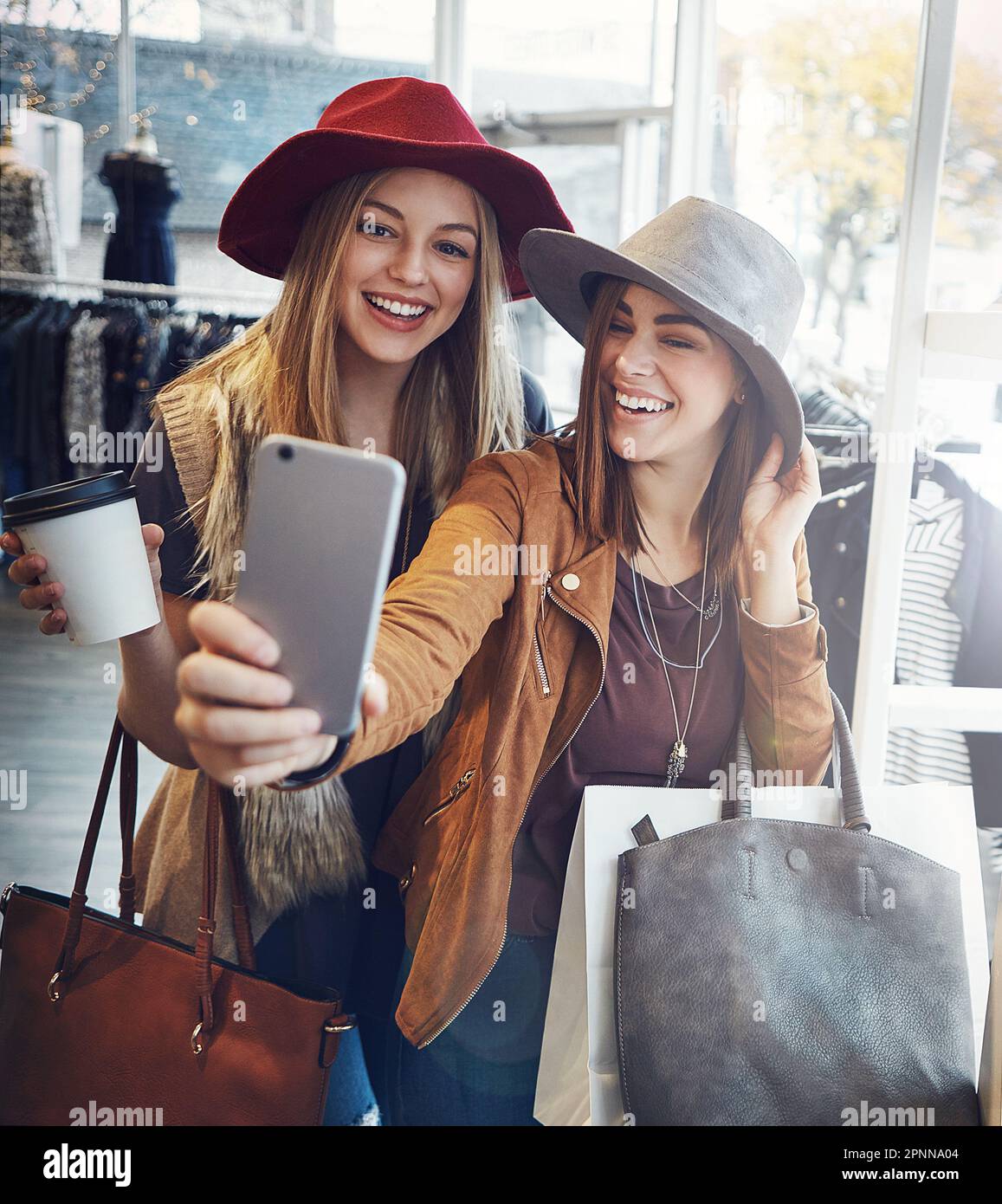 Damn, we look good. two young girlfriends snapping selfies while out on ...