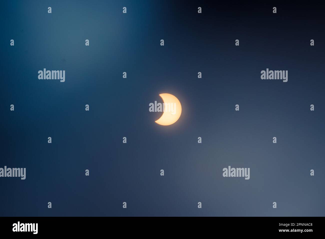 Solar Eclipse on April 20, 2023, showing the moon partially covering ...