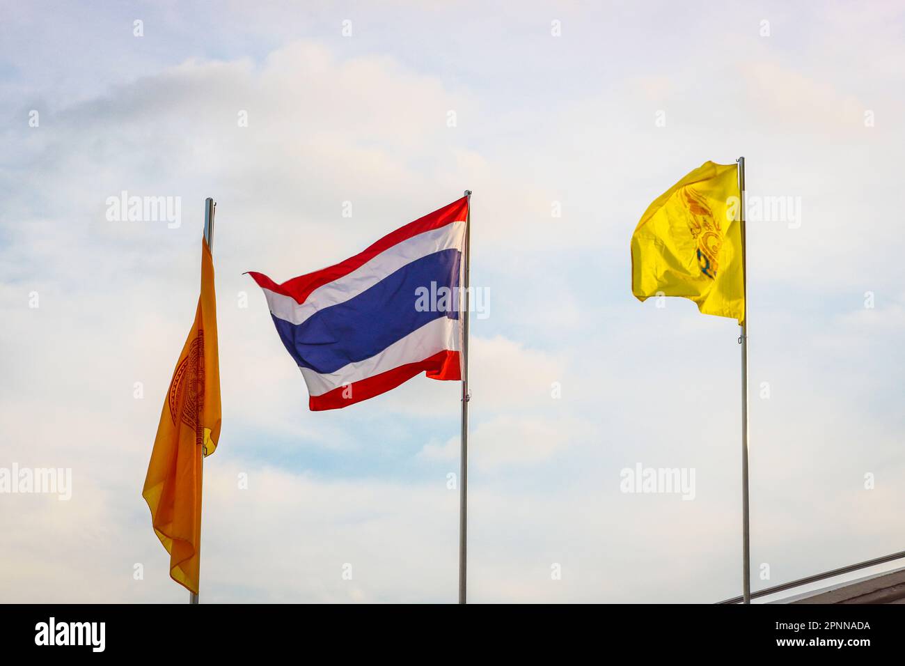 National Thai flag and Buddhist flags on the background of Bangkok ...