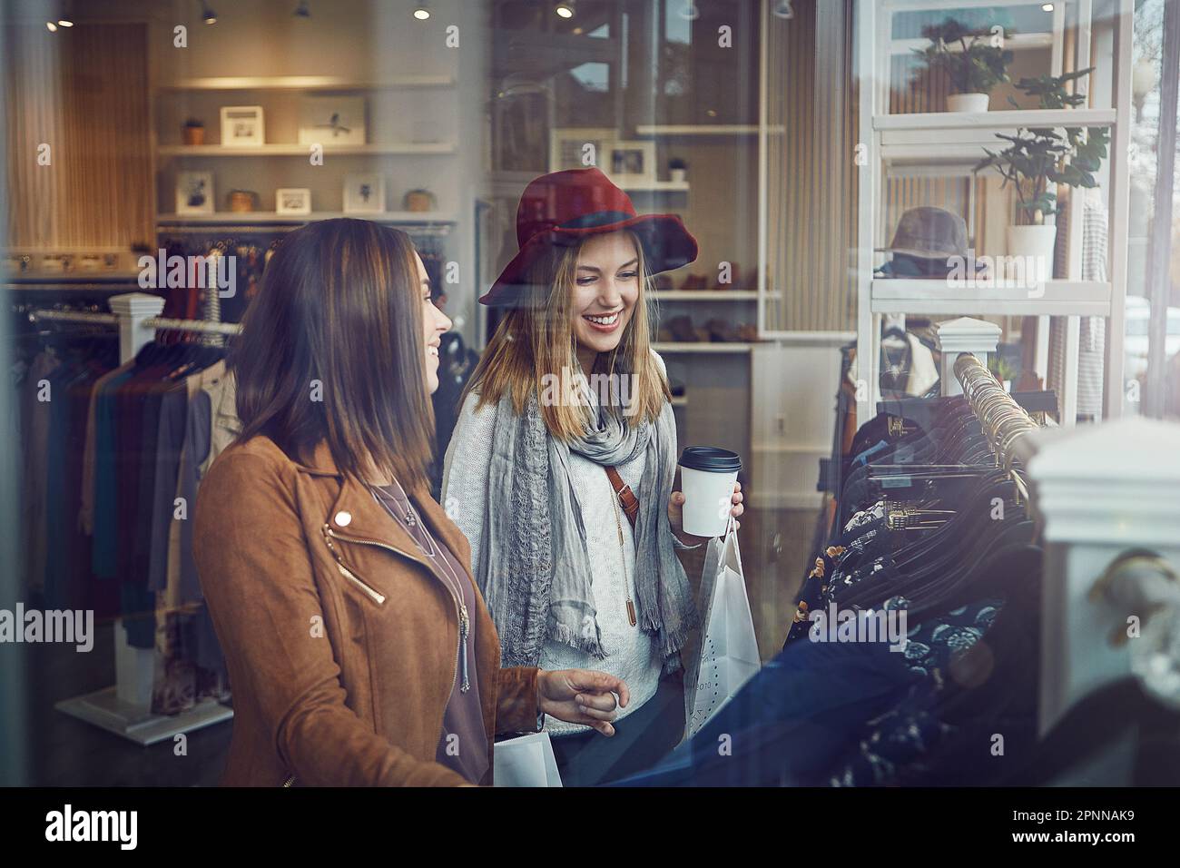Do you think itll look good on me. two best friends out shopping in a ...