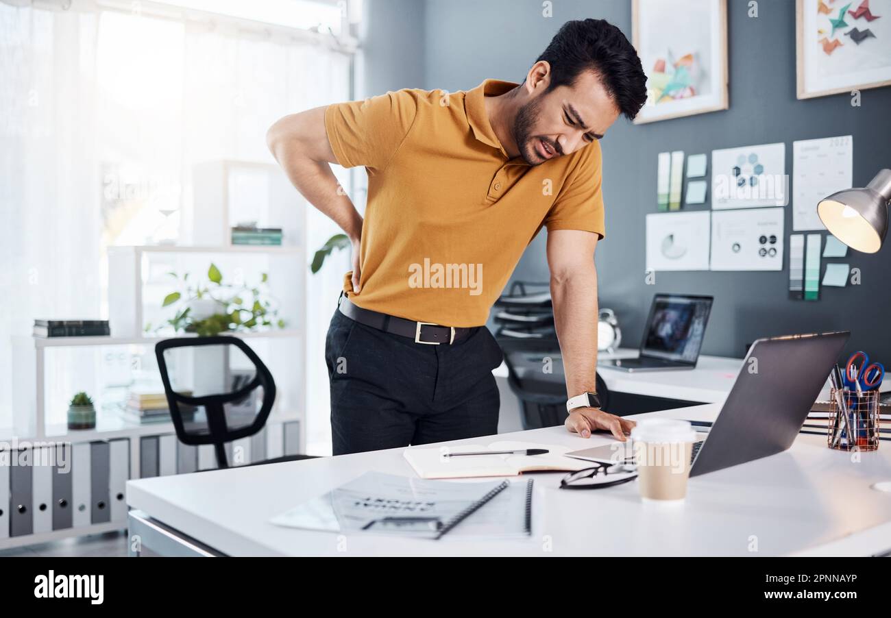 Business man, stress and back pain at office desk with a injury and ...