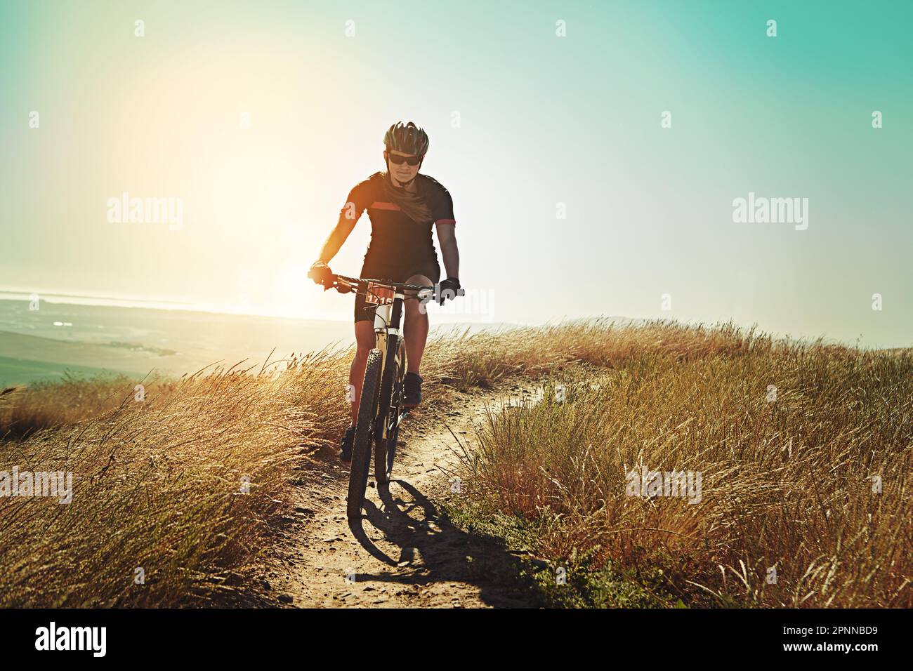 Bikers have single track minds. an adventurous woman out cycling in the ...