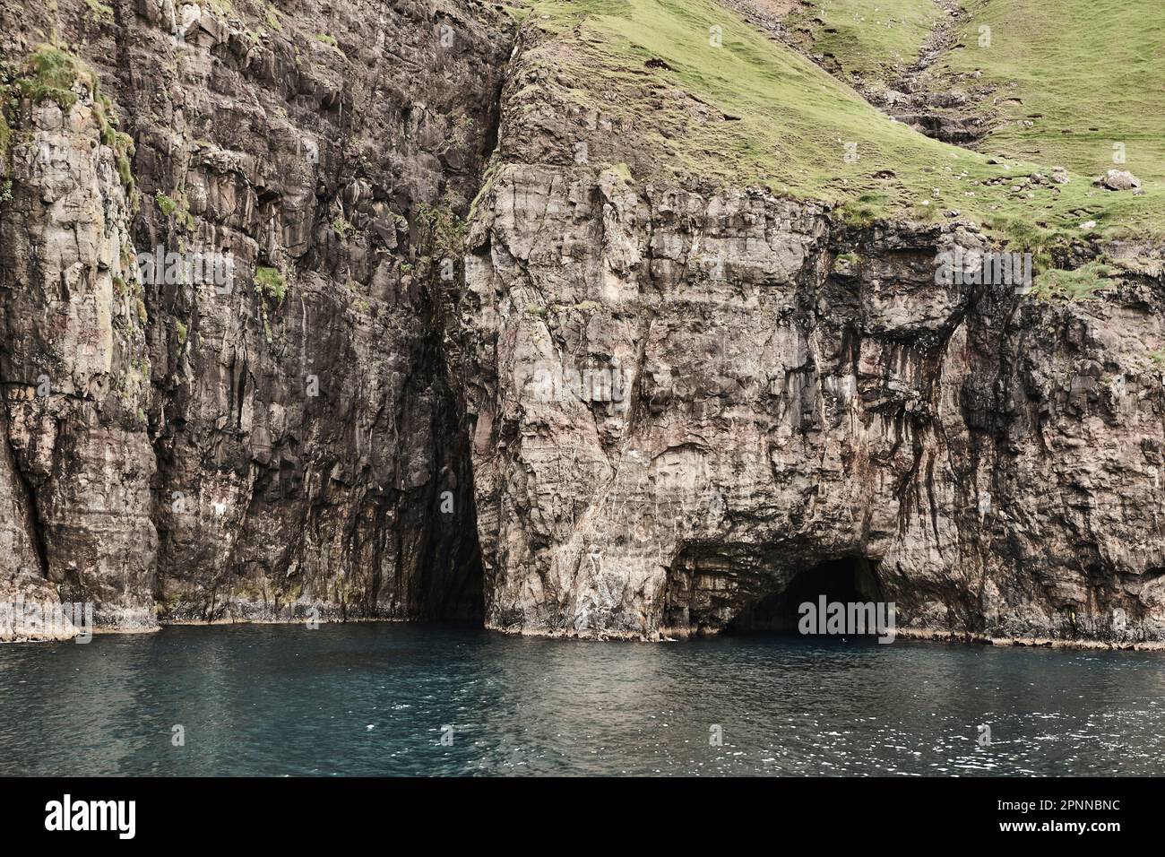 Faroe islands cliffs and caves in Vestmanna area. Streimoy island Stock ...