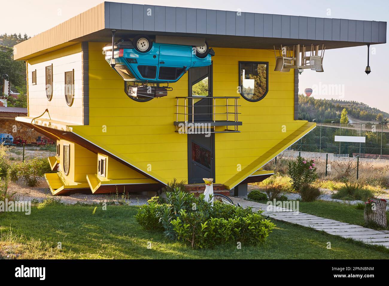 Weird upside down house. Bizarre wooden home. Funny architecture Stock Photo - Alamy
