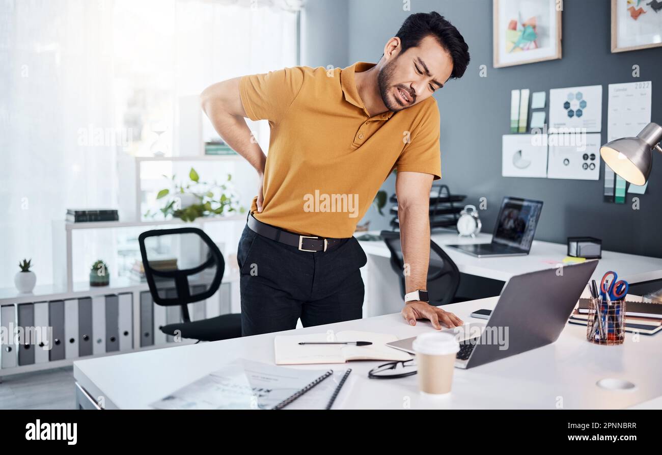 Back pain, business man and stress at office desk with an injury and ...