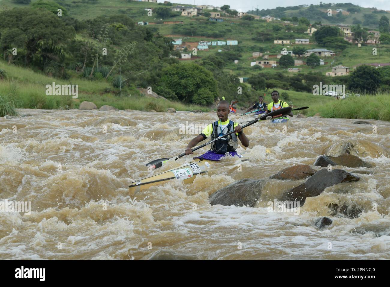 Adult men in canoeing race, extreme sport.event, Dusi Canoe Marathon ...