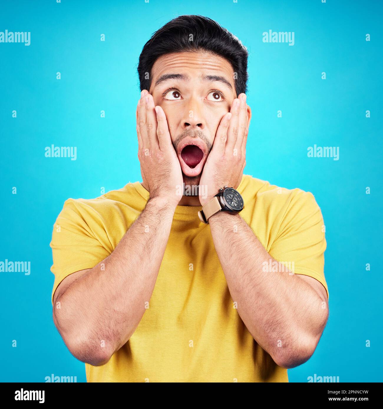Wow, shocked and man with hands on face and mouth open for surprise or ...