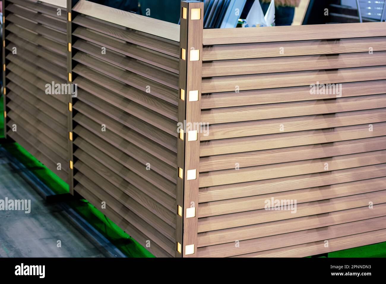 Modern decorative wooden fence with lighting Stock Photo - Alamy