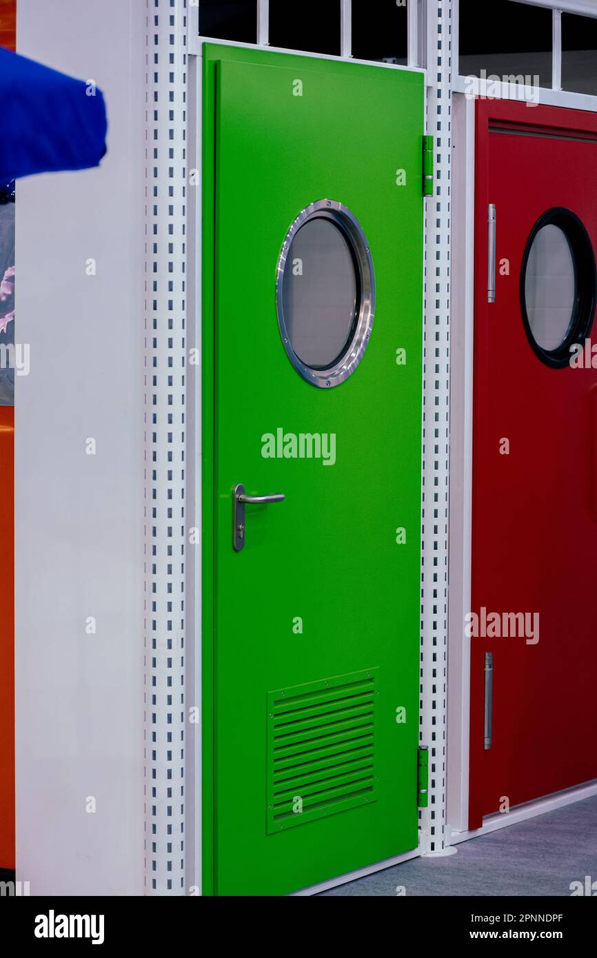 Iron doors with a round observation window Stock Photo - Alamy