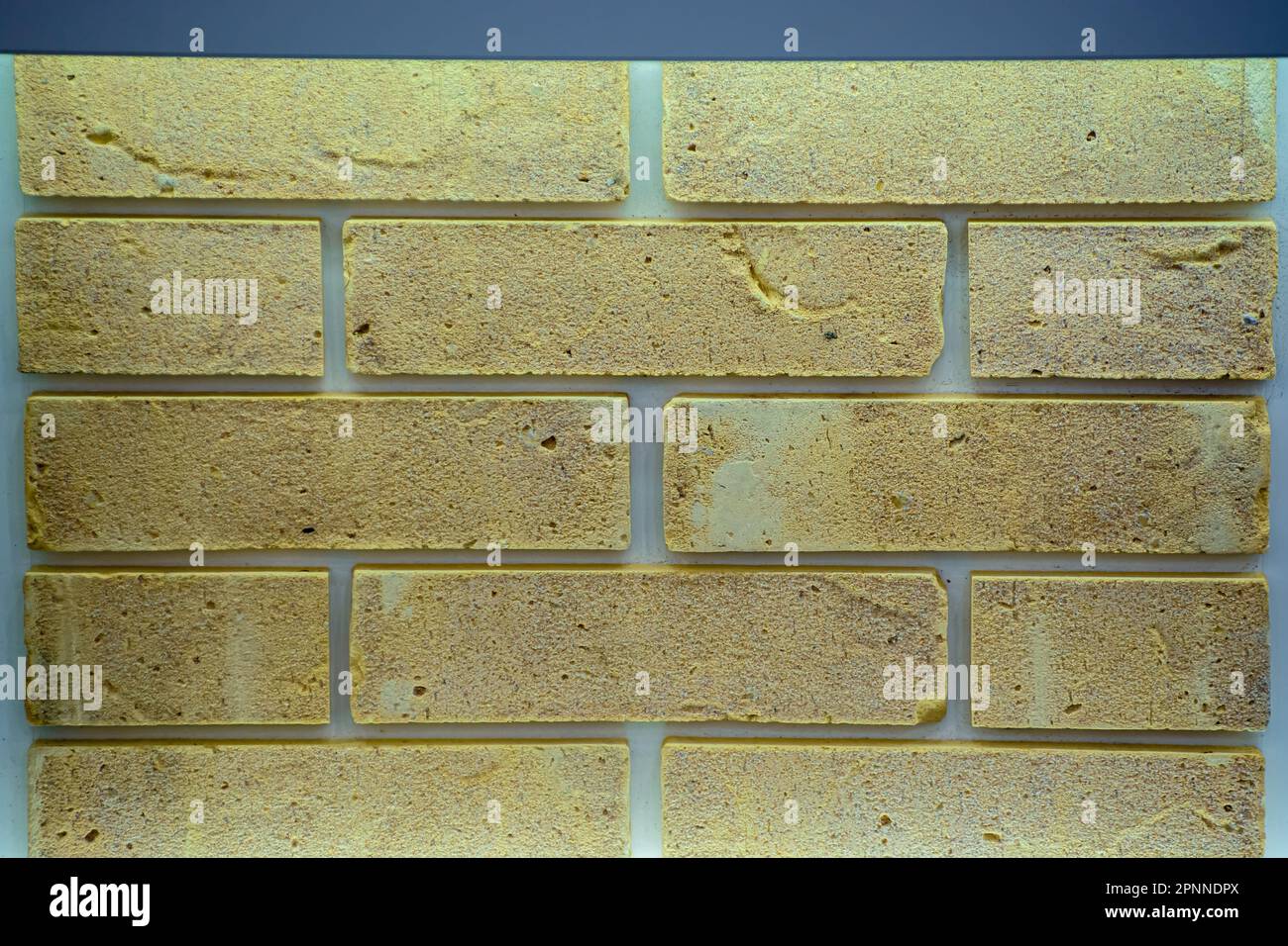Fragment of yellow brickwork. Neat brickwork Stock Photo - Alamy