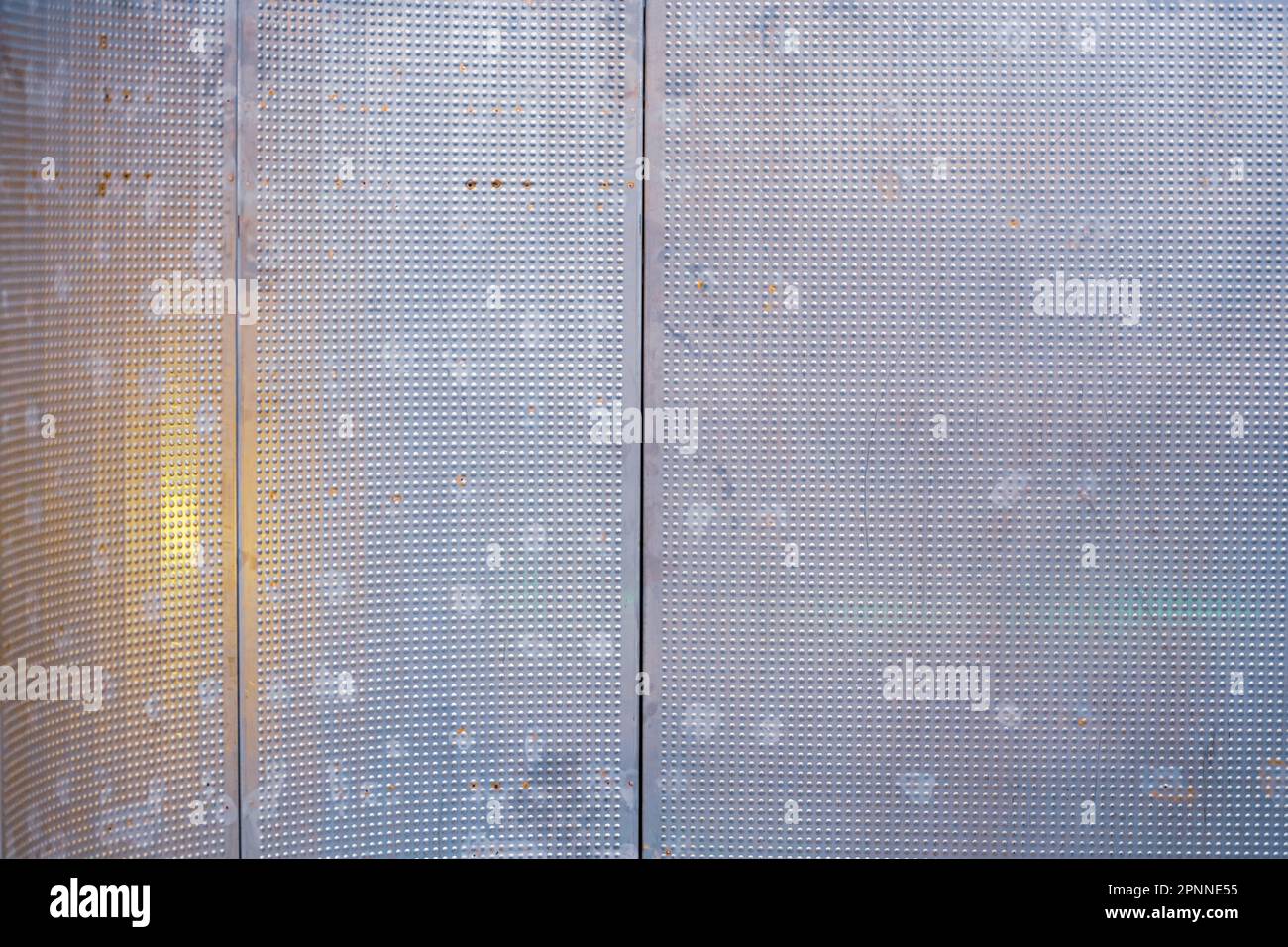 Perforated metal fencing systems in silver color Stock Photo - Alamy