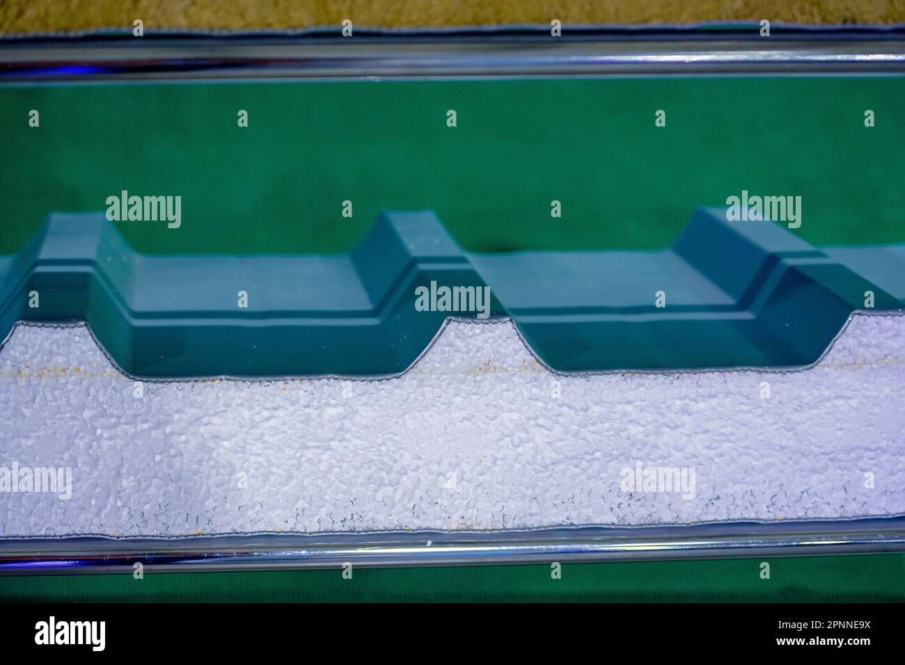 Foam insulation under a tin roof Stock Photo - Alamy