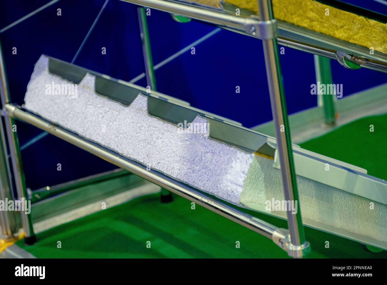 Foam insulation under a tin roof Stock Photo - Alamy