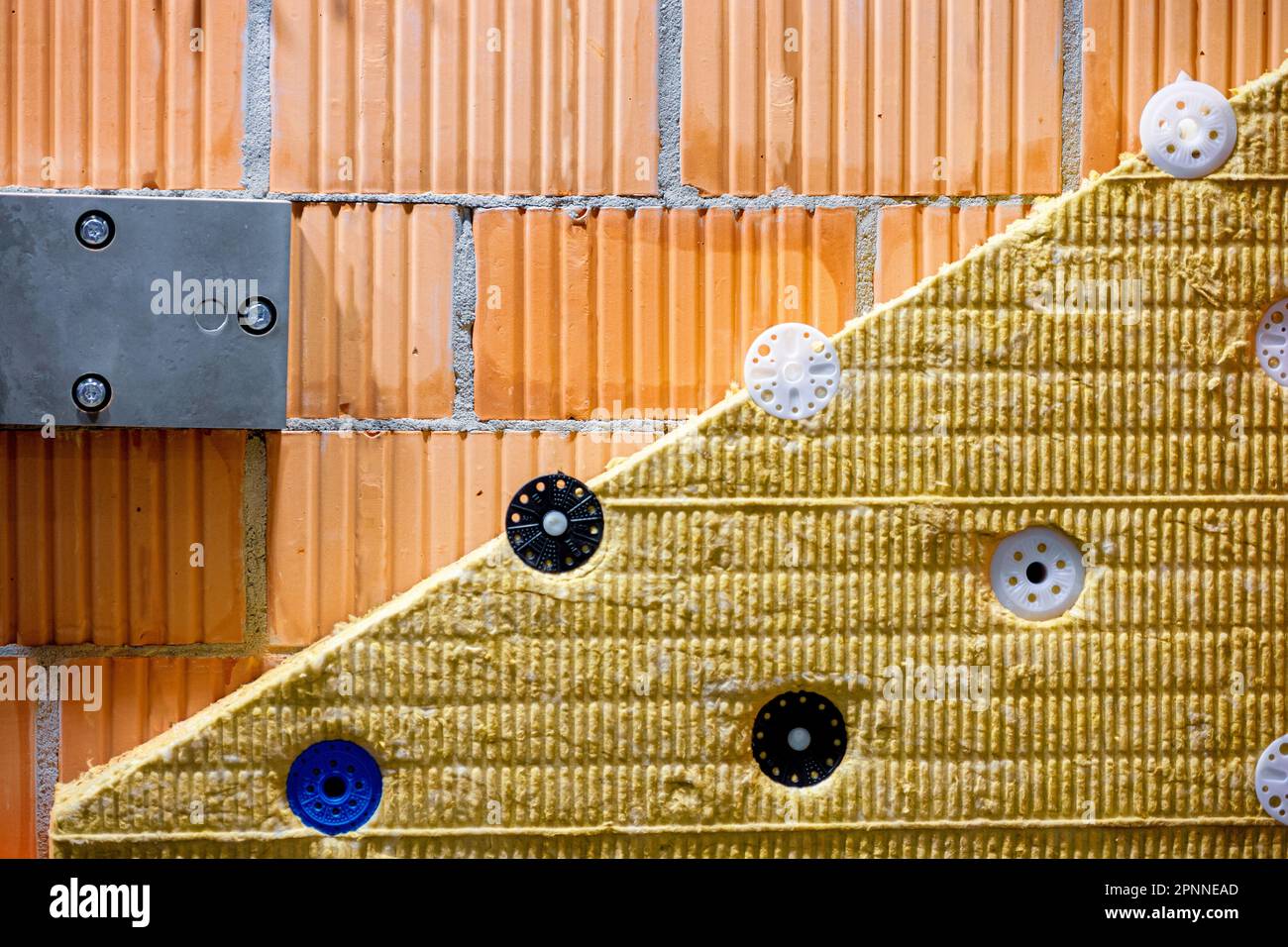 Wall masonry technology with insulation Stock Photo - Alamy
