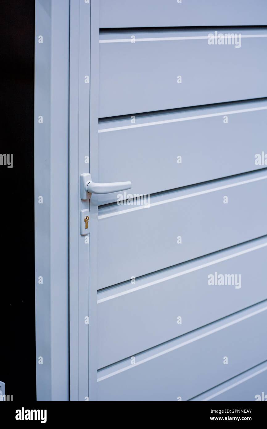 White metal-plastic doors with lock and handle Stock Photo - Alamy