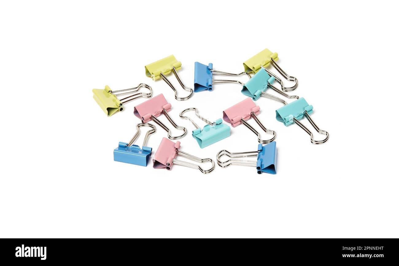 Multicolor binder clips isolated white background. Heap of color ...