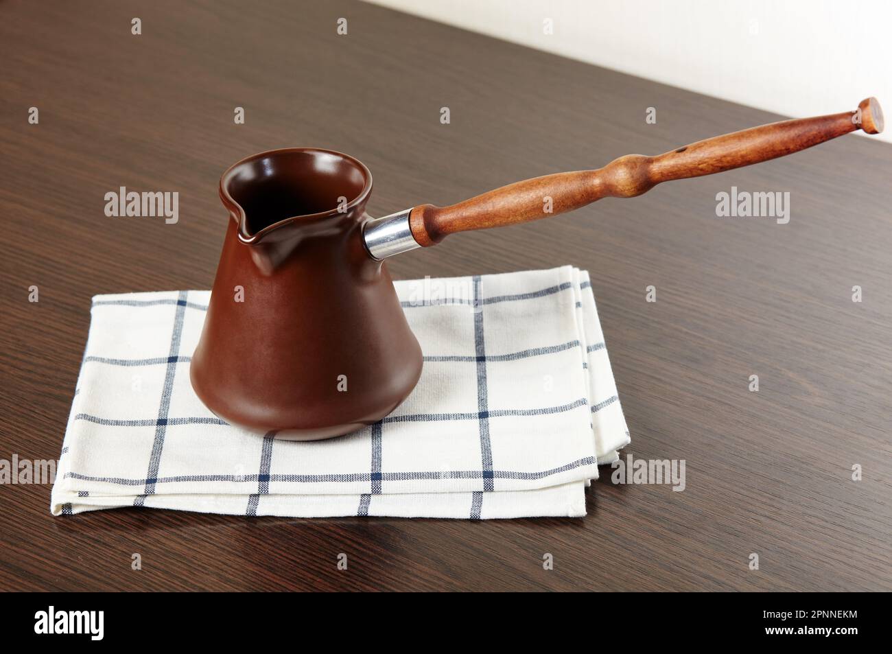 Clay cezve for making coffee. Coffee turk on the table Stock Photo - Alamy