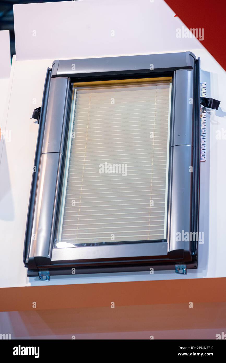 Reinforced-plastic roof window with two opening axes Stock Photo - Alamy