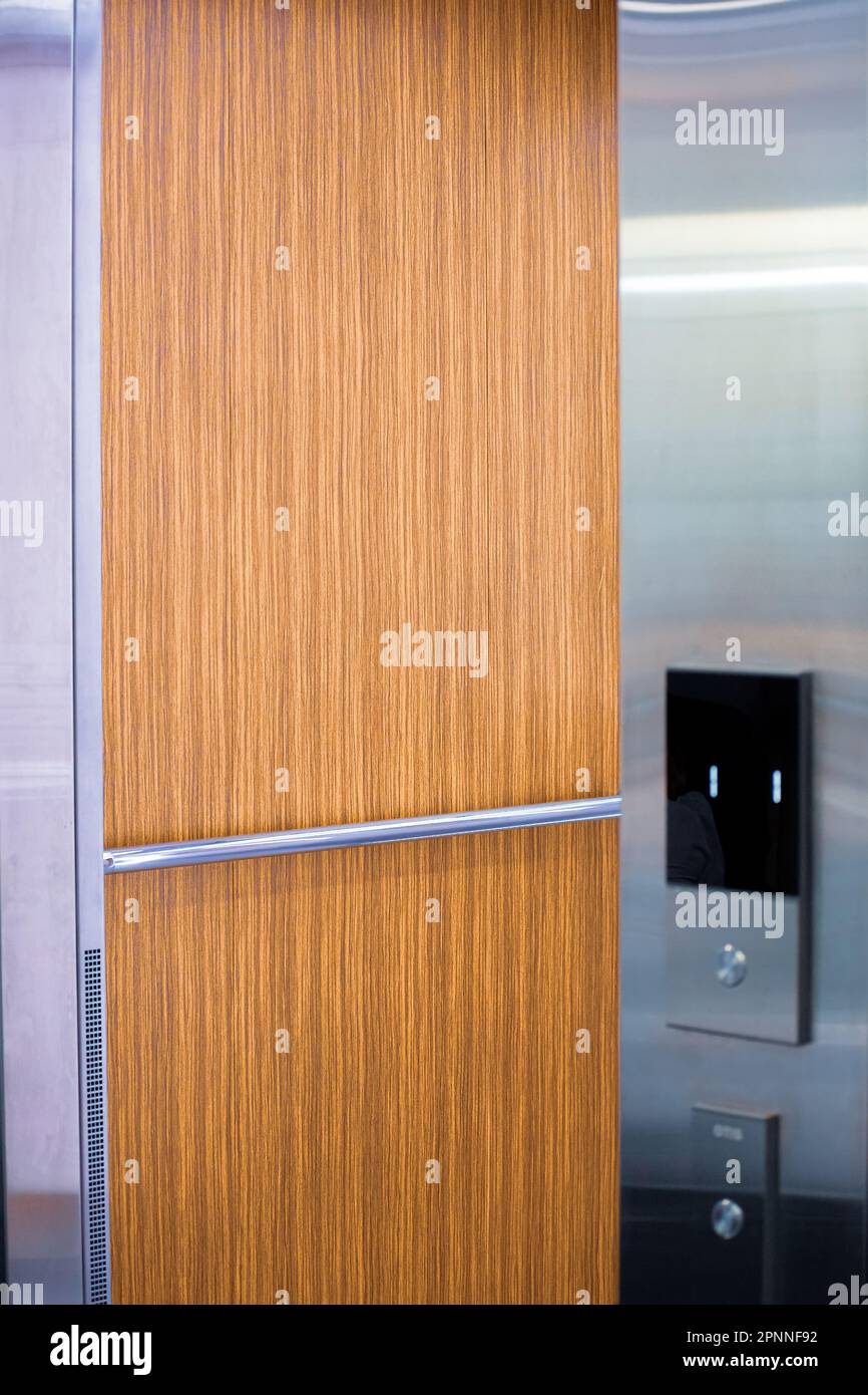 Opened elevator doors. Elevator call button Stock Photo - Alamy