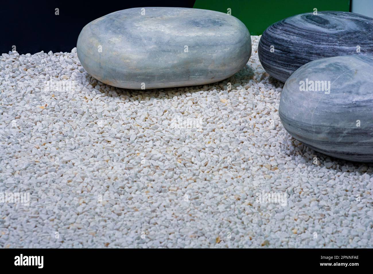 Small white pebbles for decoration and a few rounded stones Stock Photo ...