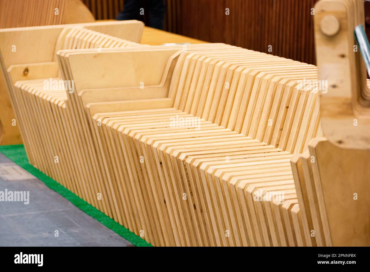 Wooden parametric furniture. Parametric bench sofa Stock Photo - Alamy