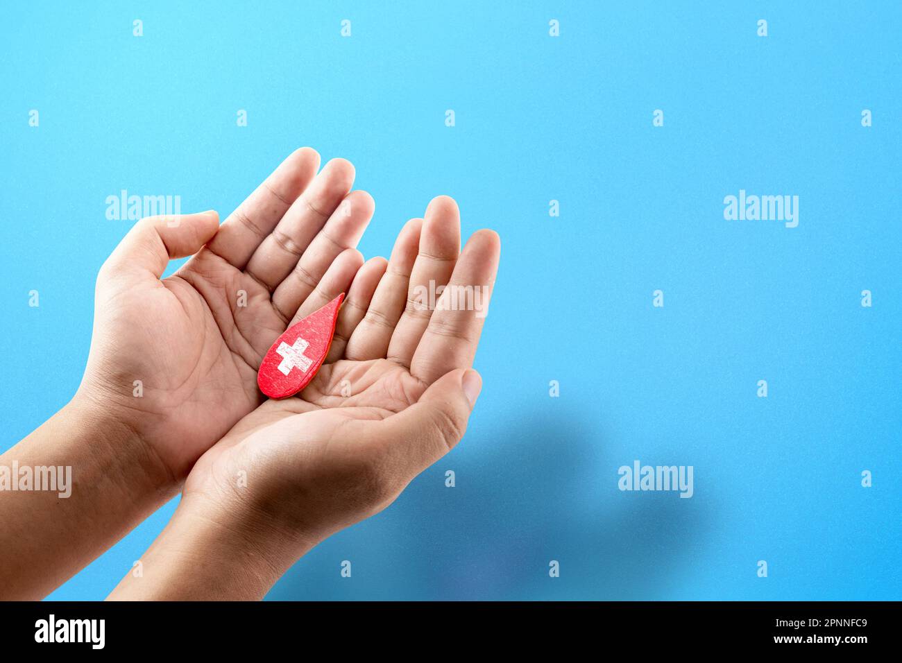 Human hand showing red blood drop. World blood donor day concept Stock ...
