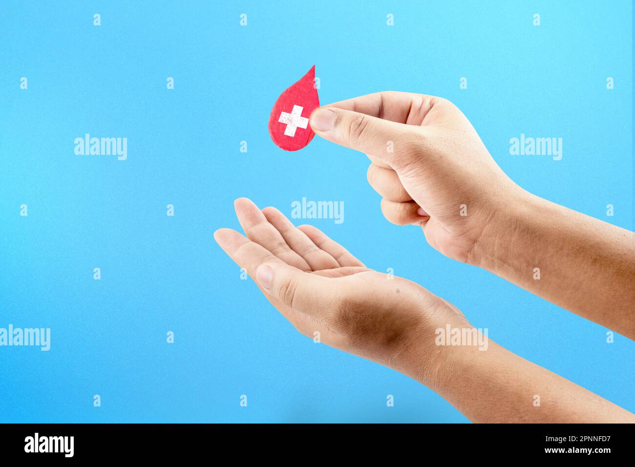 Human hand giving red blood drop. World blood donor day concept Stock ...