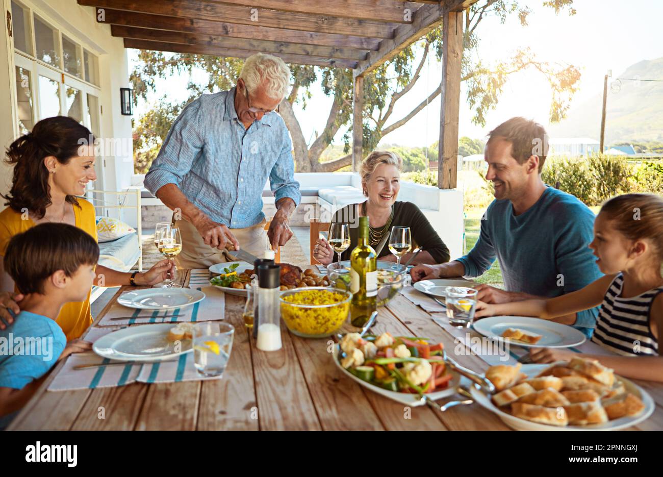 Sunday roast with the kids and the folks. a family enjoying a meal ...