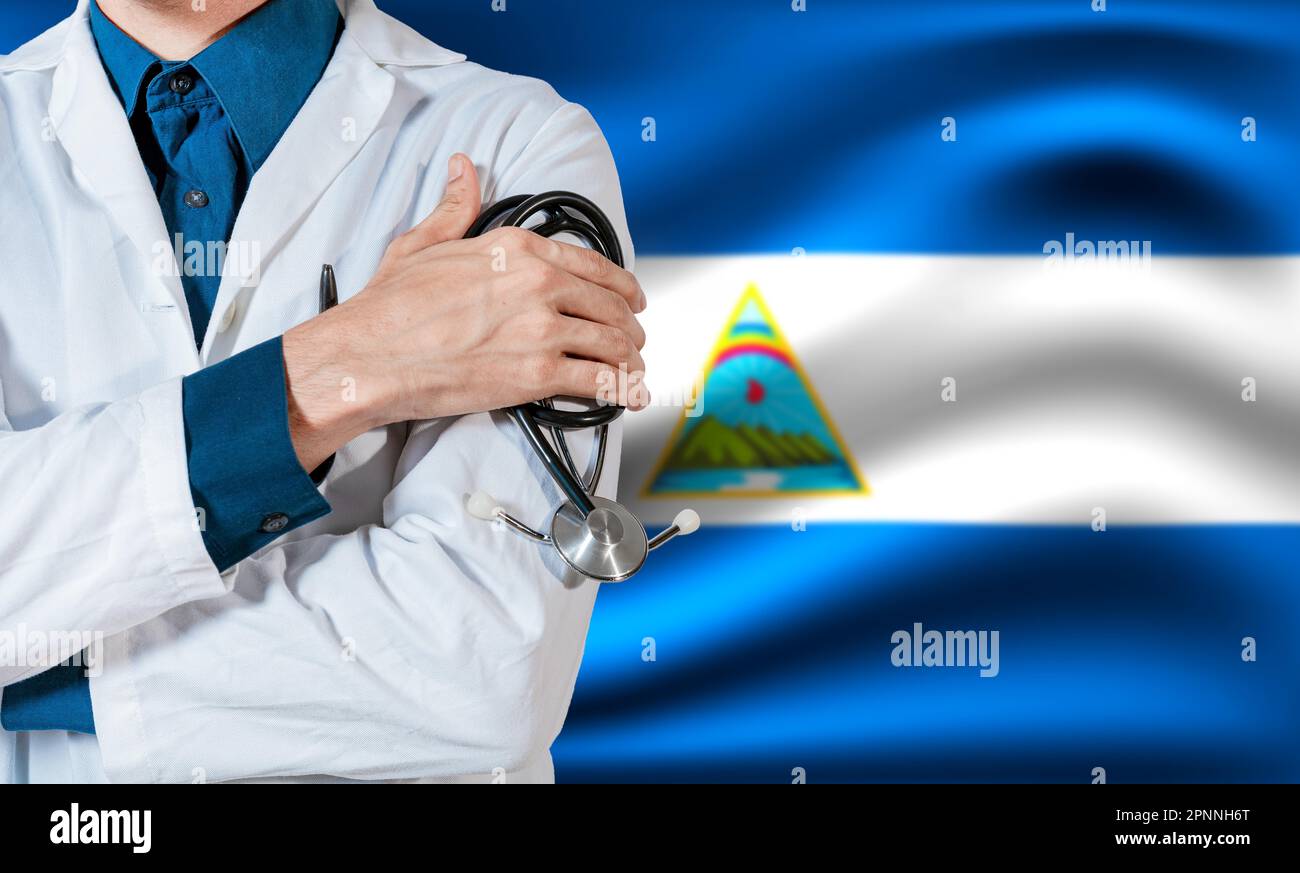 Doctor with stethoscope on Nicaragua flag. Health and care with the ...