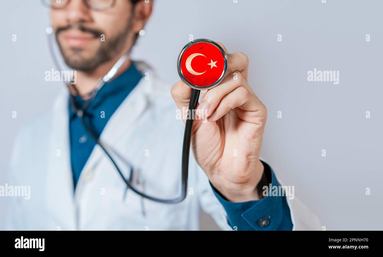 Doctor holding stethoscope with Turkey flag. Turkey Health and Care ...