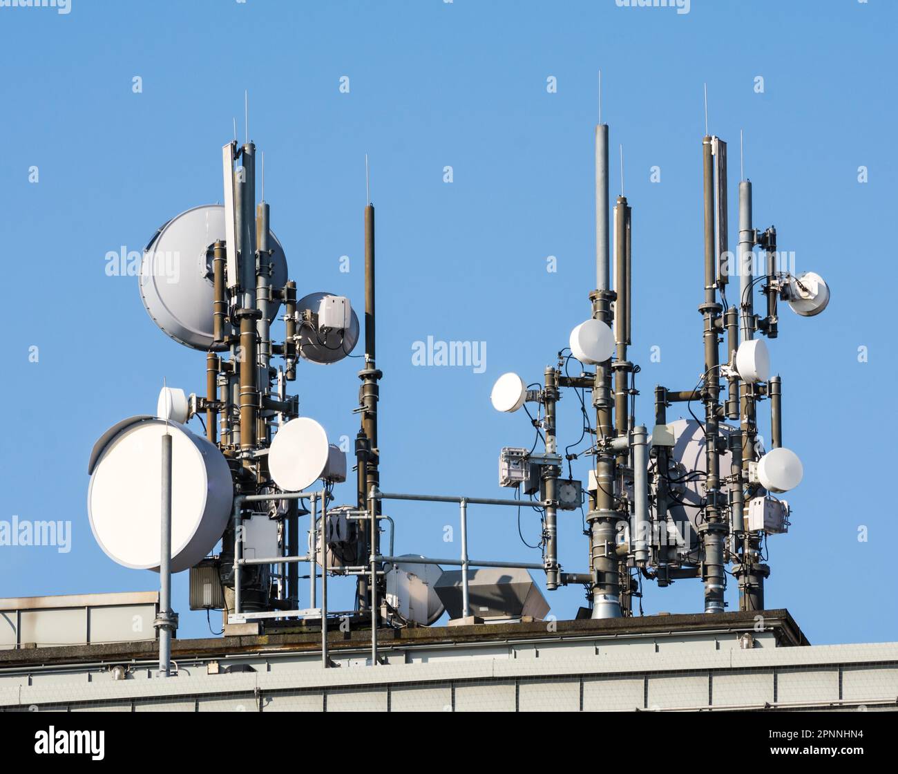 Lots of telcommunication antennas on the roof of a house Stock Photo ...