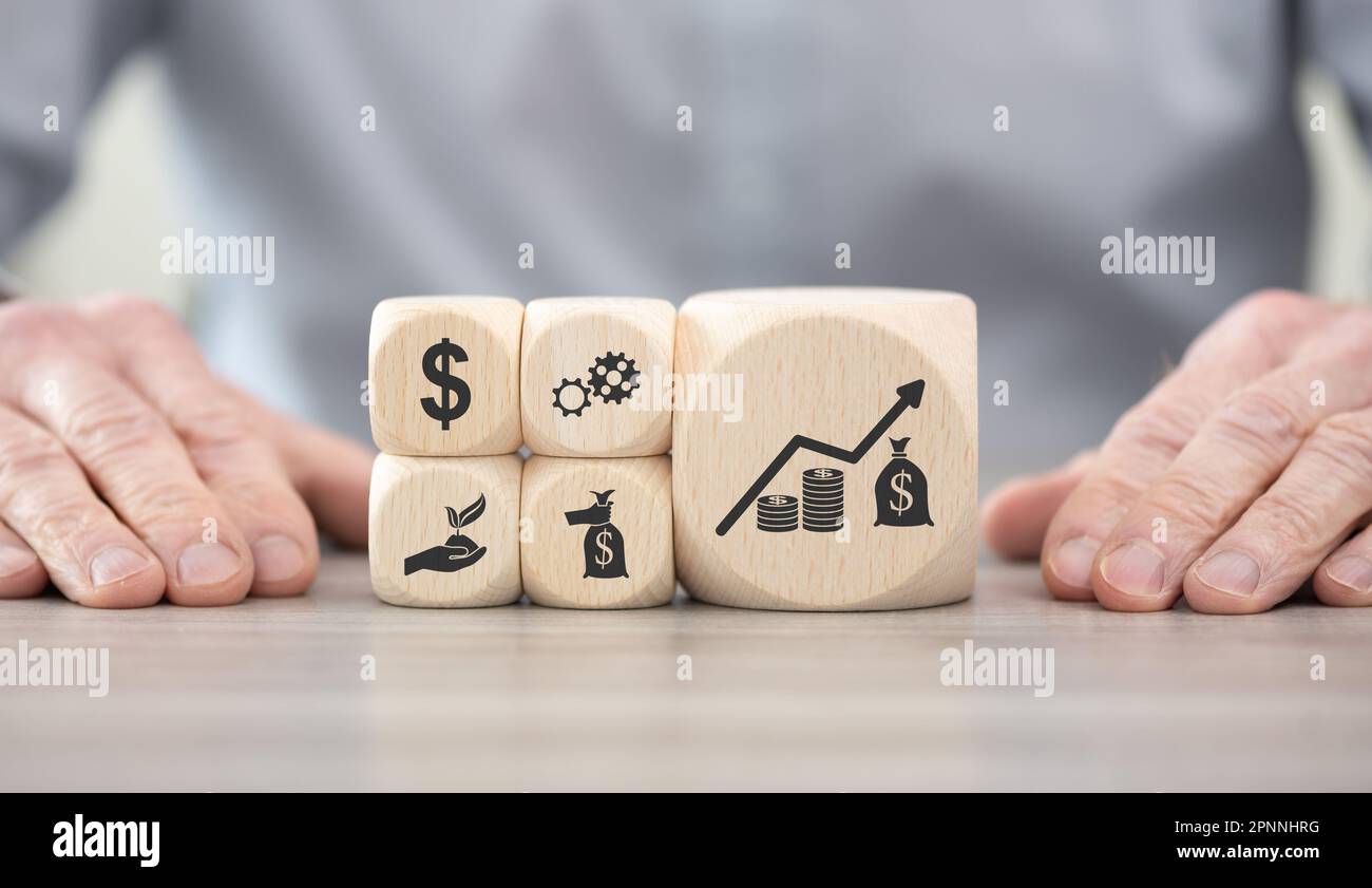 Wooden blocks with symbol of profit concept Stock Photo - Alamy