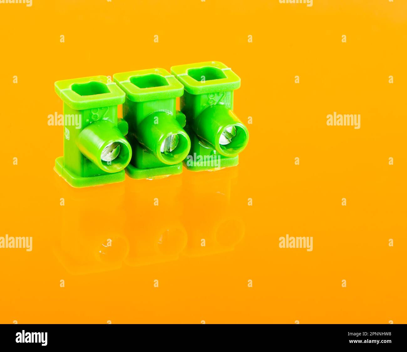 Macro of a green screw terminal Stock Photo - Alamy
