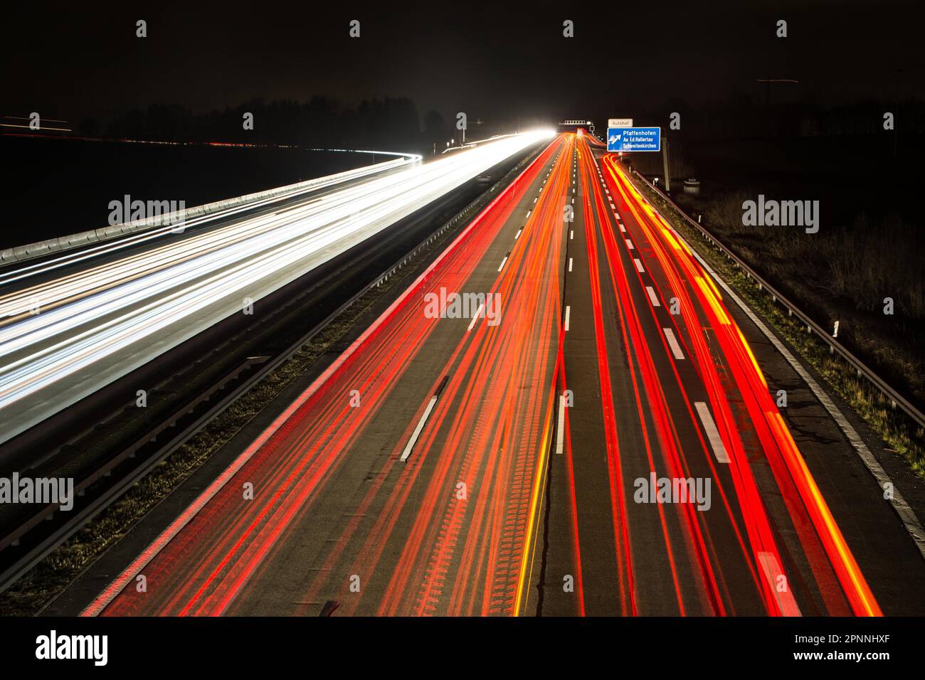 Light trails on a german Autobahn (Highway) at the motorway exit ...