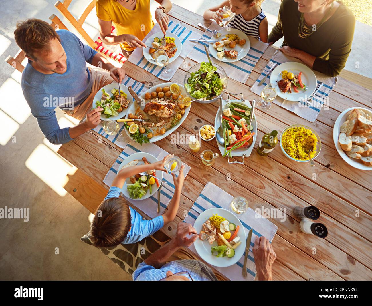 Sunday lunch - the highlight of the week. a family enjoying a meal ...