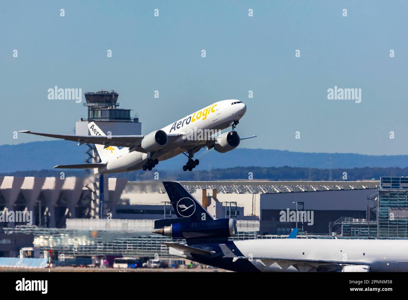 Boeing 777F of the airline AeroLogic during take-off at Fraport Airport ...
