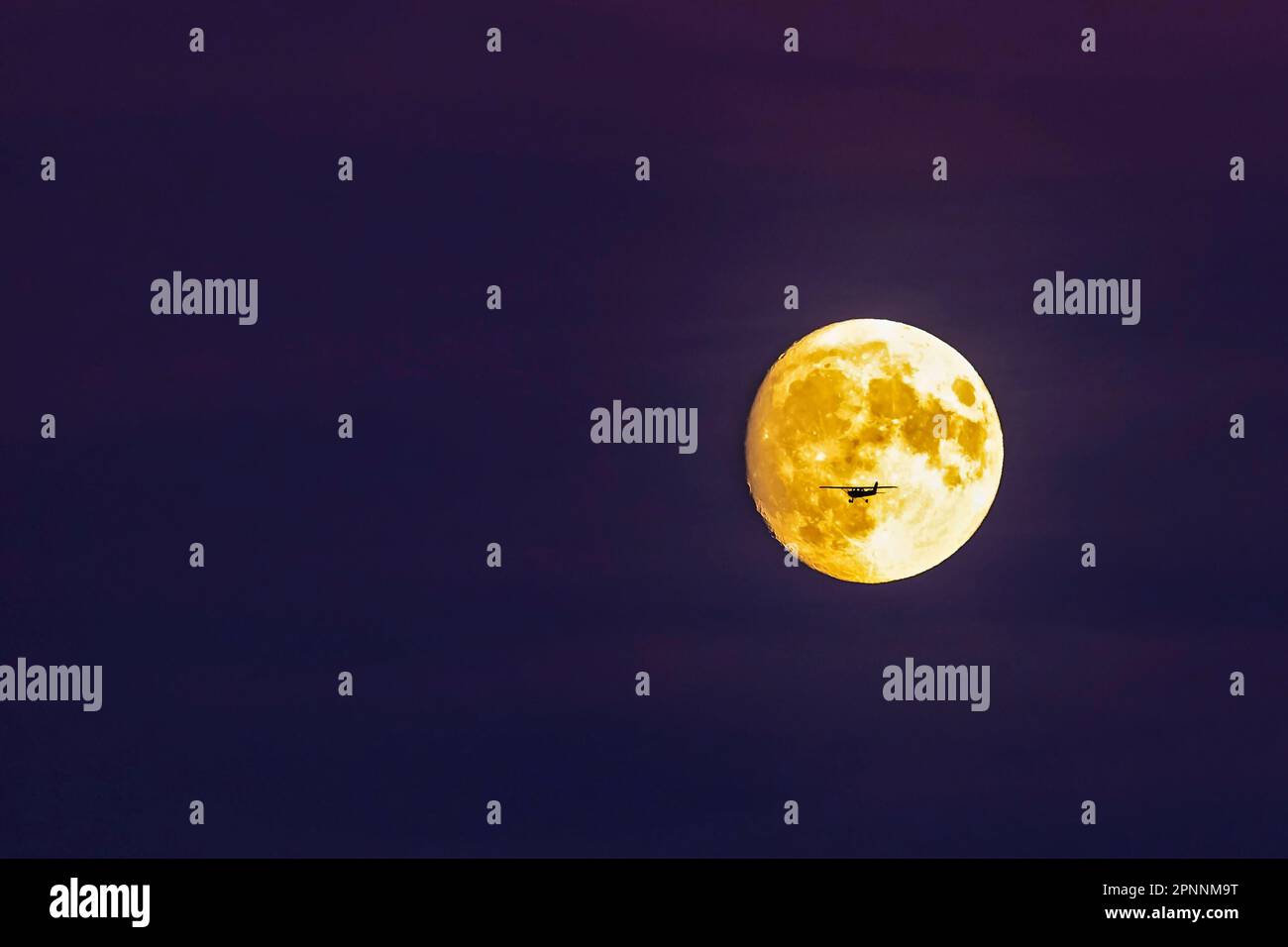 Small single-engine private plane in front of the full moon, Stuttgart ...