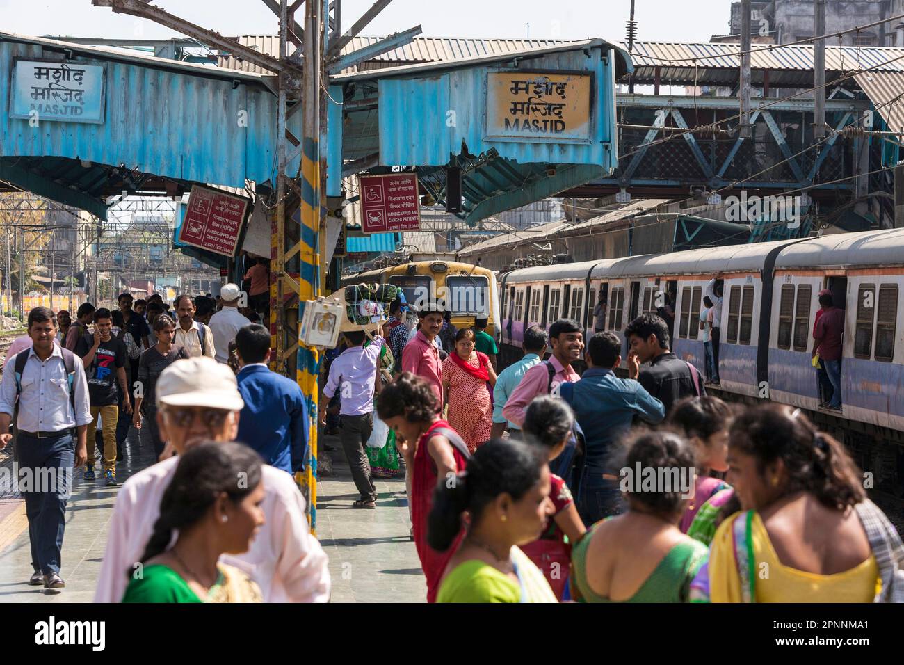 Crowded trains and passengers at MASJID STATION of the Central Line ...