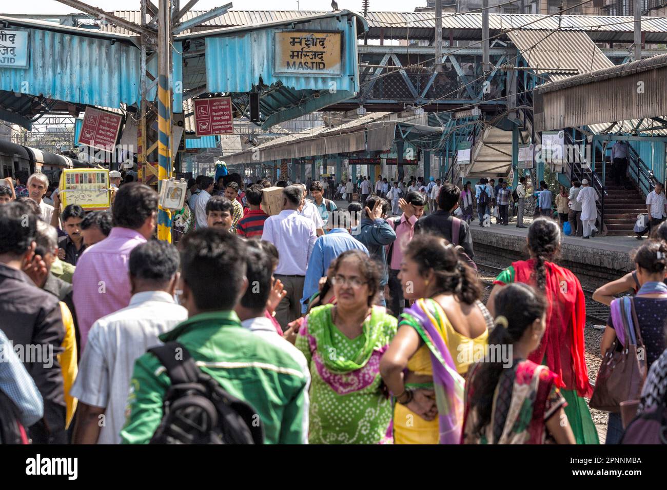 Crowded trains and passengers at MASJID STATION of the Central Line ...