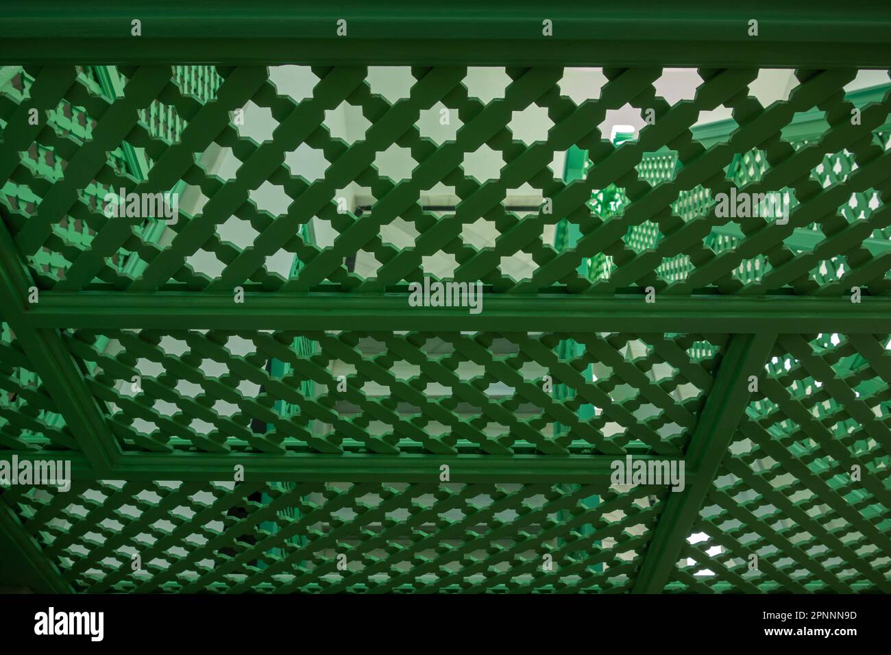 green lattice railings and sunshine Stock Photo - Alamy