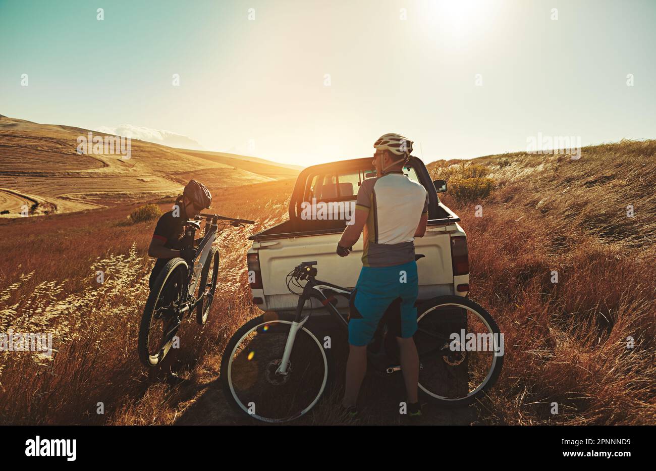 Partners in adventure. a pair of adventurous mountain bikers getting ...