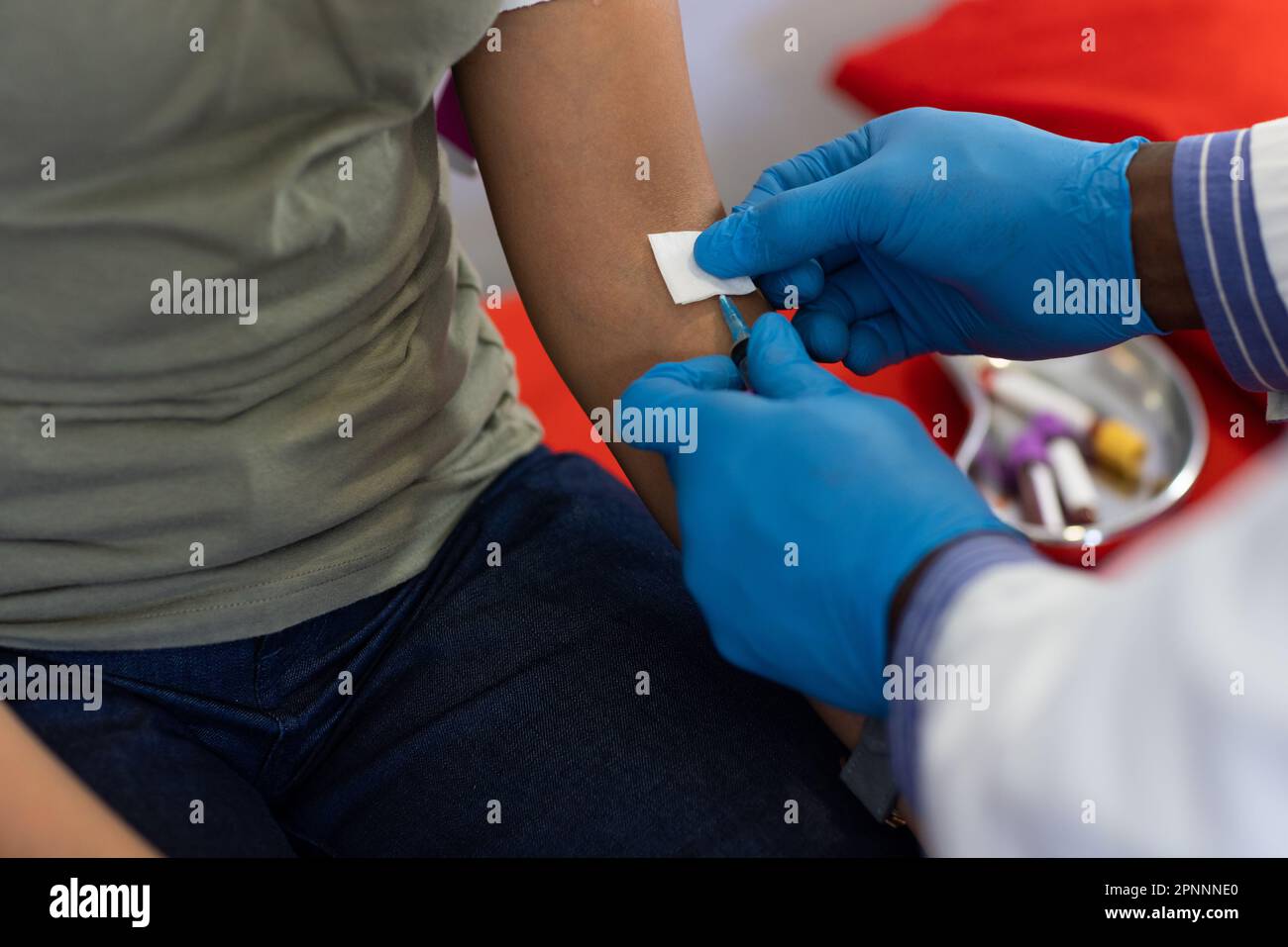 African american male doctor and biracial female patient collectiong ...