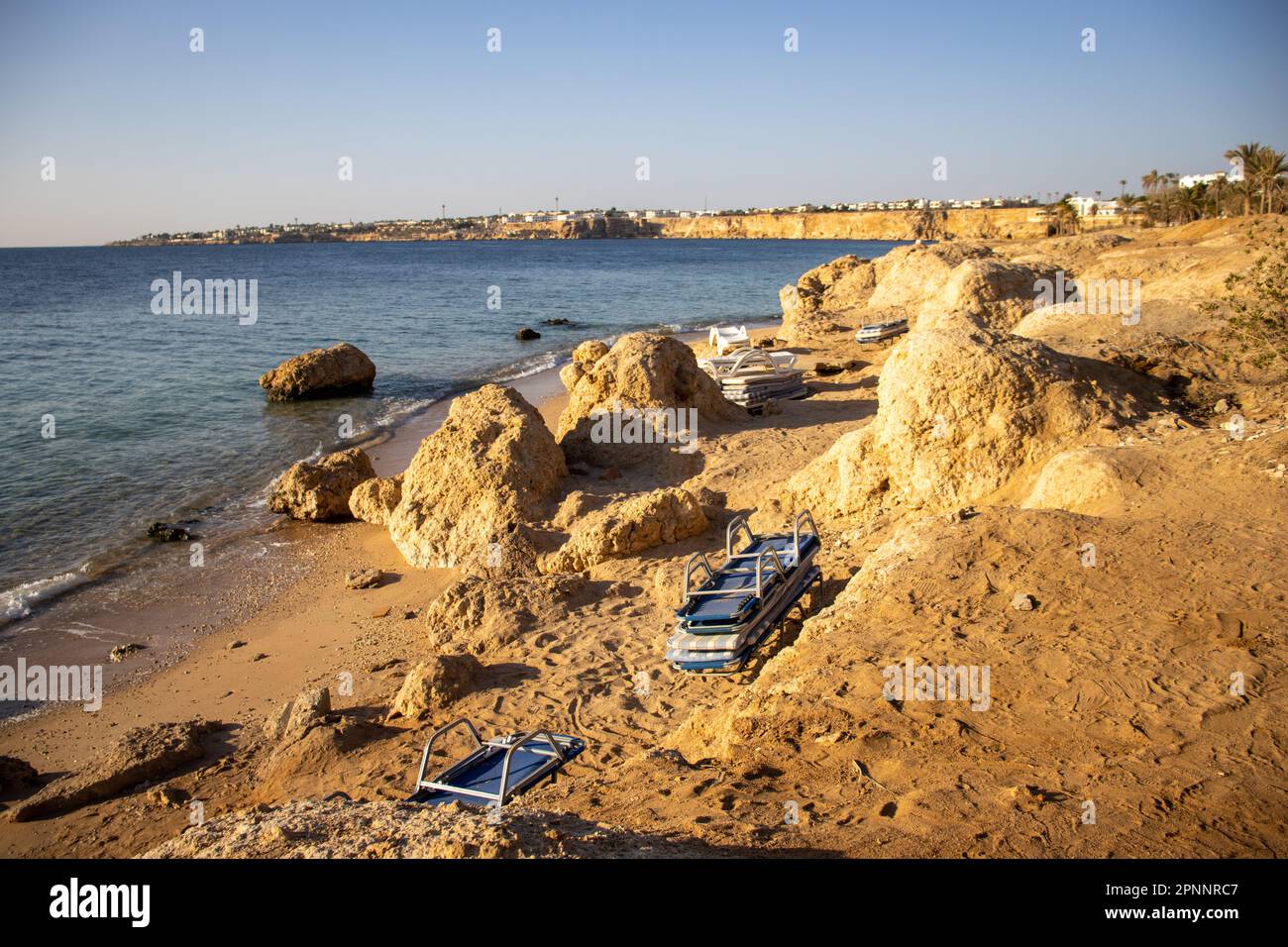 Beautiful rocky beach sunbeds hi-res stock photography and images - Alamy