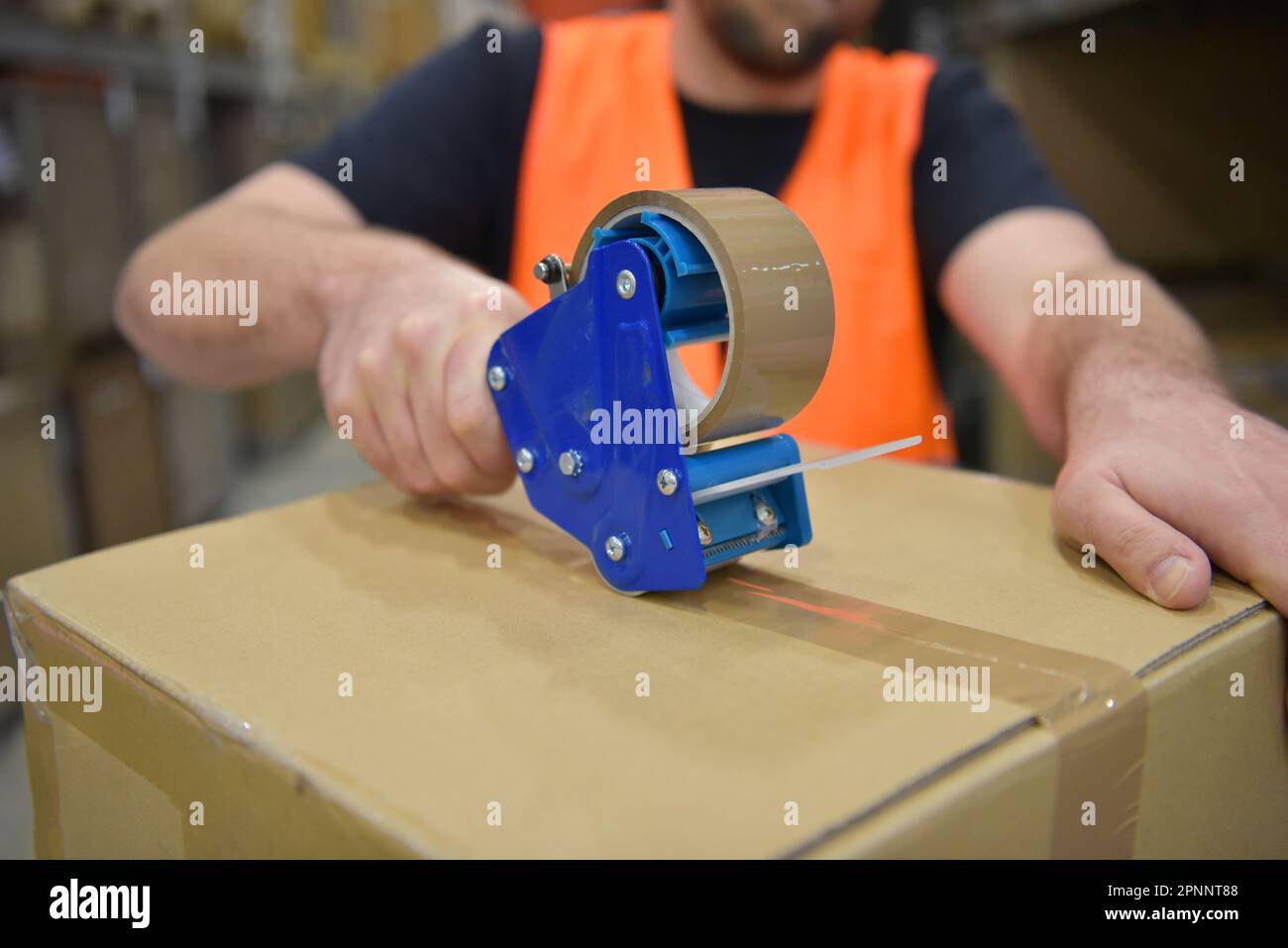 workers in a goods warehouse in the retail trade packaged a package ...