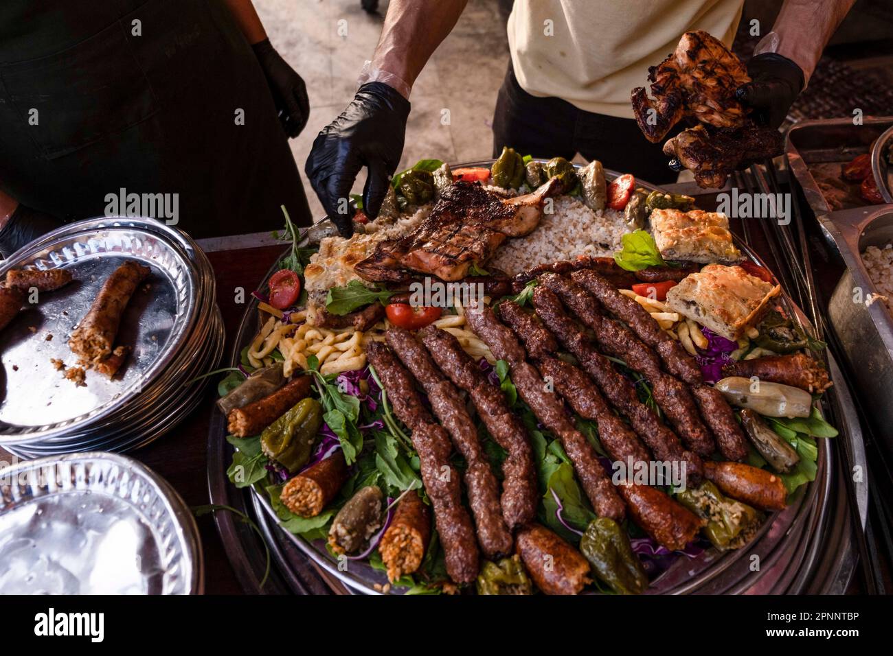 Cairo, Egypt. 18th Apr, 2023. Workers prepare food for Iftar at a ...
